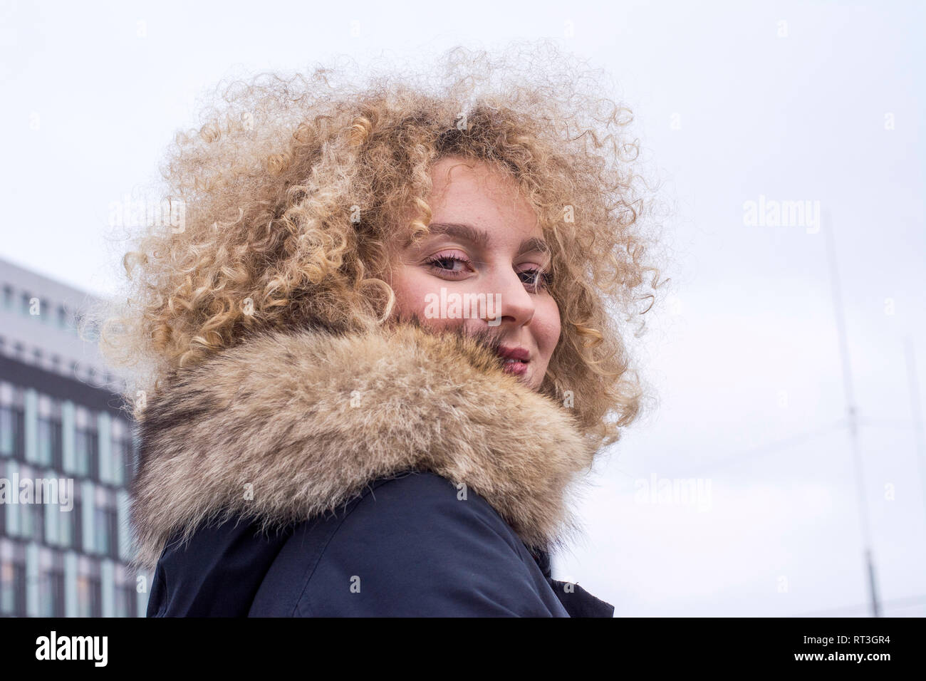 Portrait smiling blond woman ringlets wearing fur collar hi-res stock ...