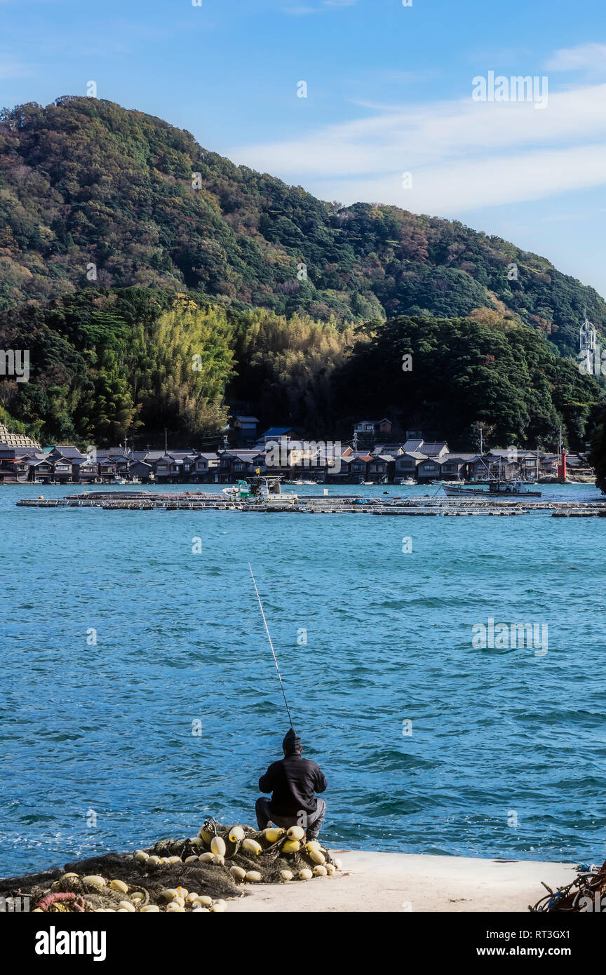 Japan, Kyoto Prefecture, fishing village Ine, townscape with angler ...