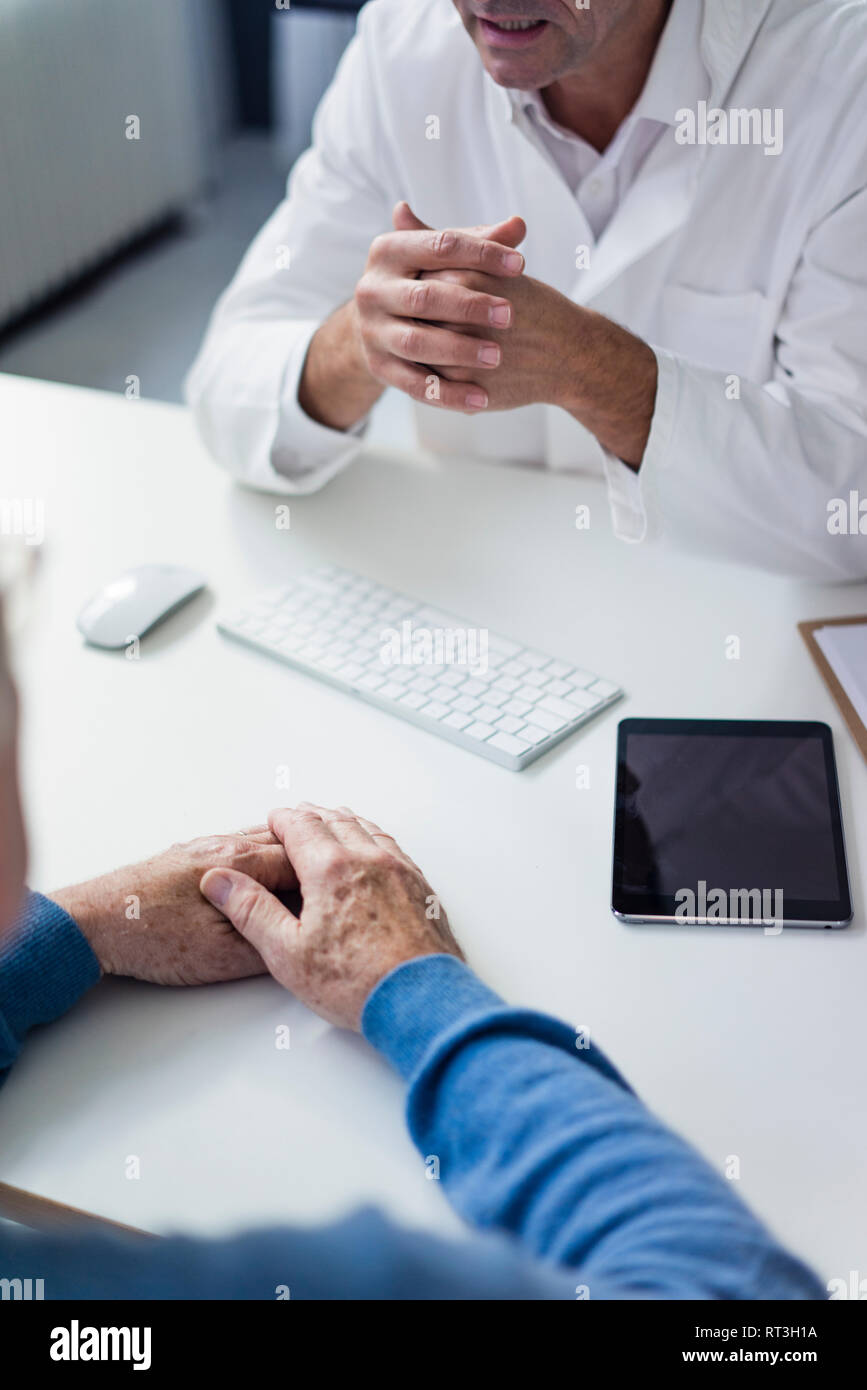 Senior doctor patient talking hi-res stock photography and images - Alamy
