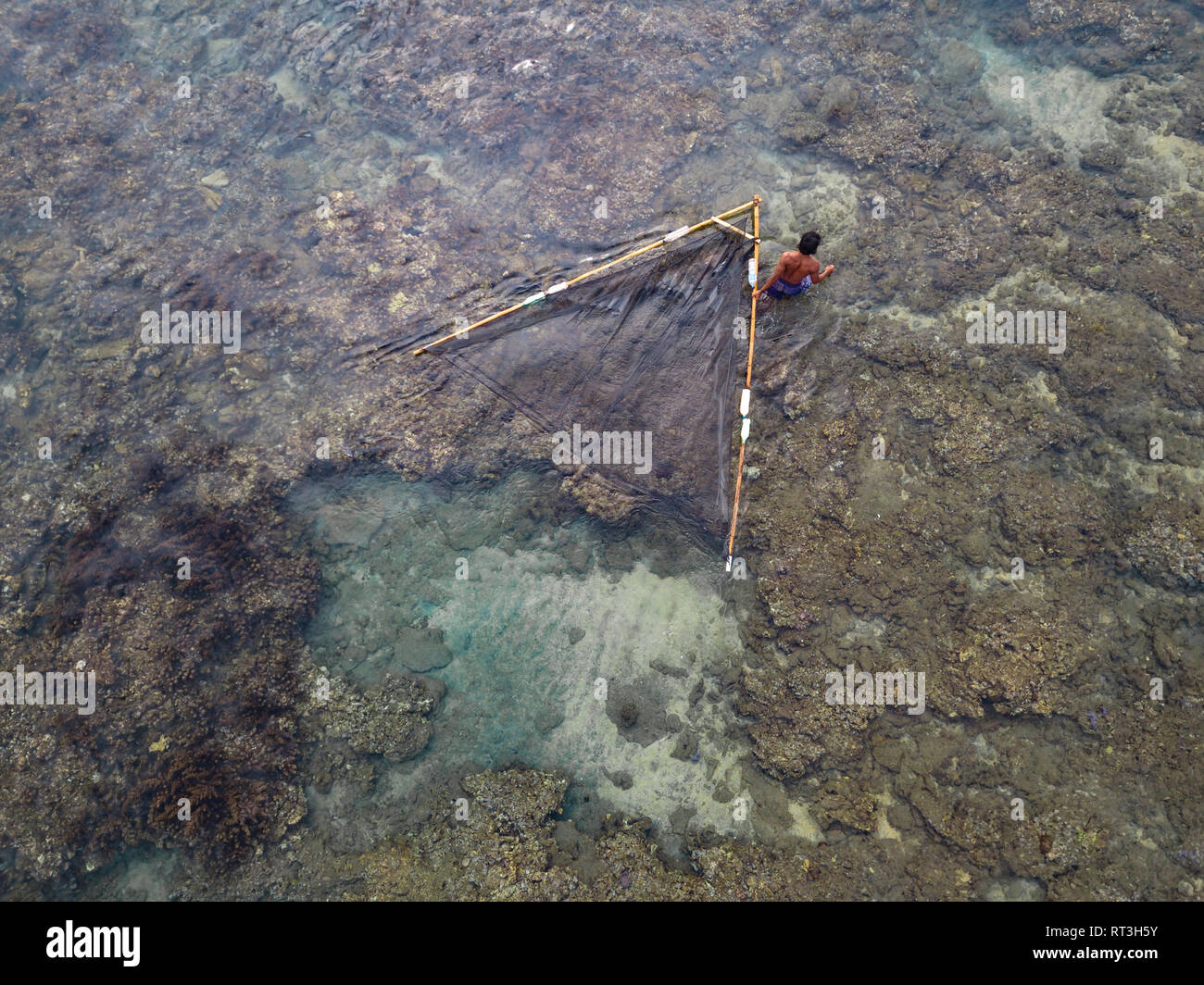 Indonesia, Bali, Aerial view of fisherman with net Stock Photo - Alamy