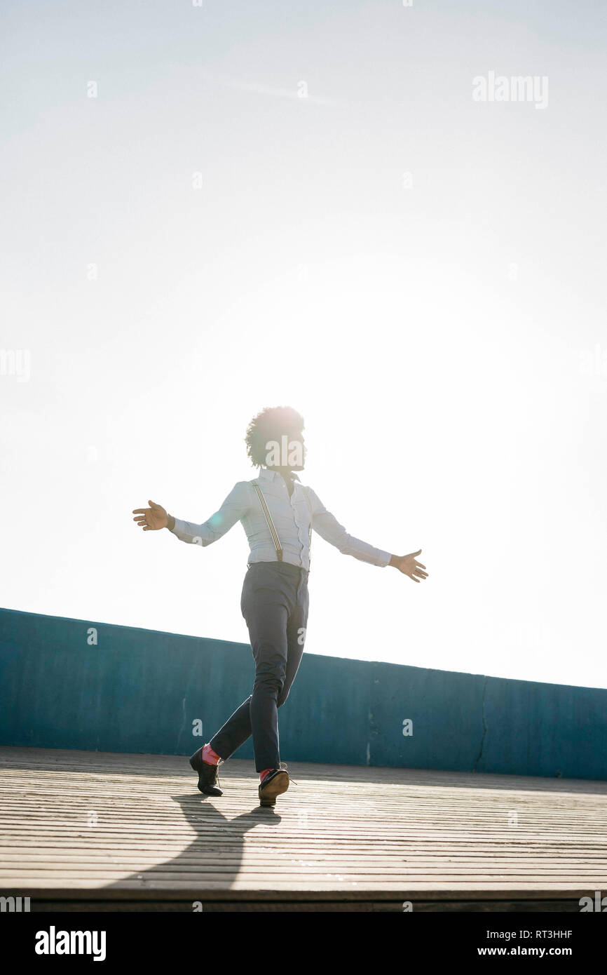 Man dancing at backlight Stock Photo - Alamy