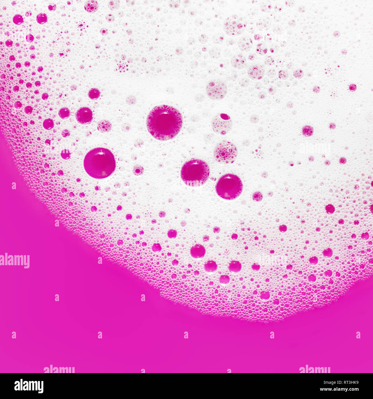 Soap foam with bubbles on bright purple background. Soap sud in water ...