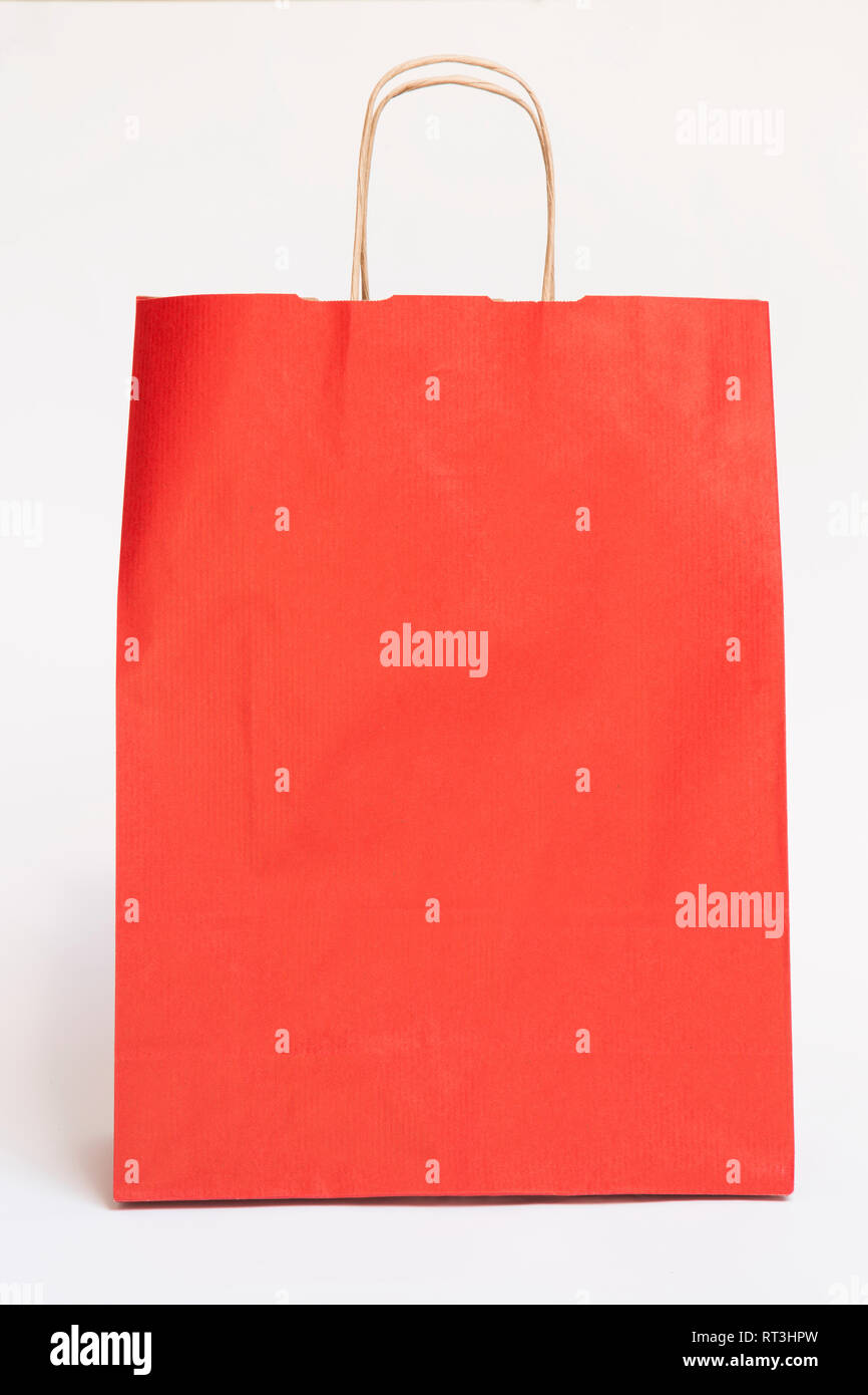 Decorative red paper bag on white background Stock Photo - Alamy