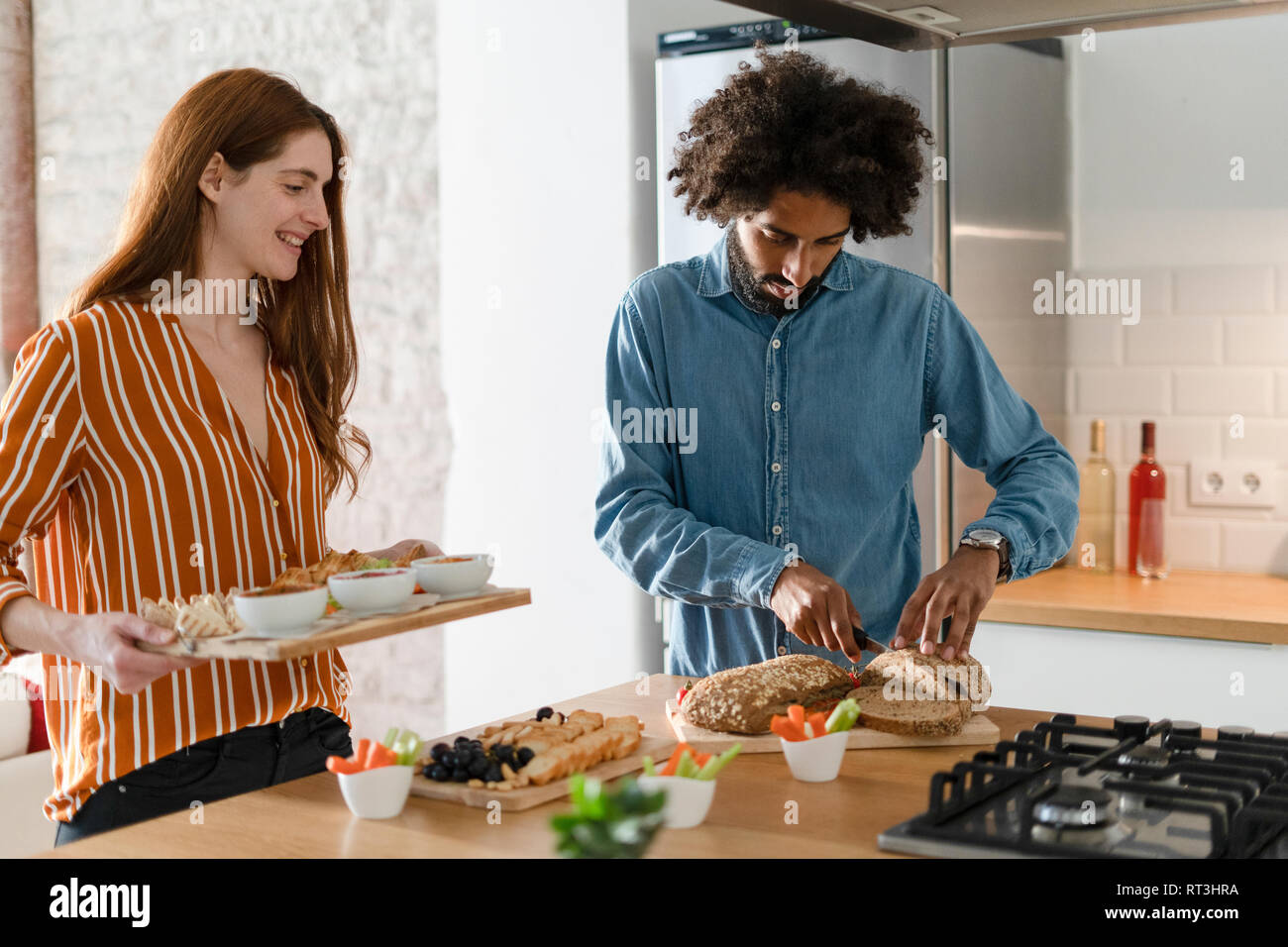 Woman serve food dinner party hi-res stock photography and images - Alamy