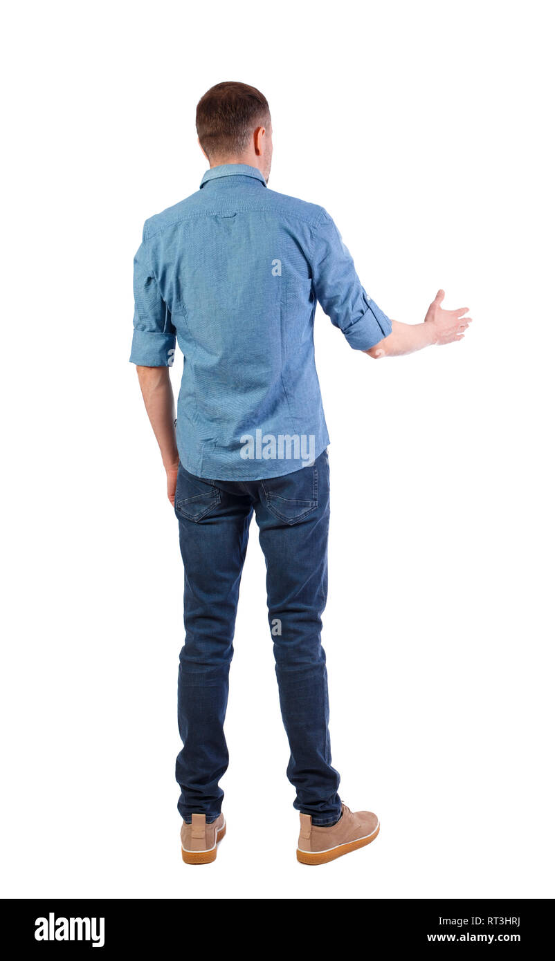 Back view of a man who stretches his hand for a handshake. Rear view ...