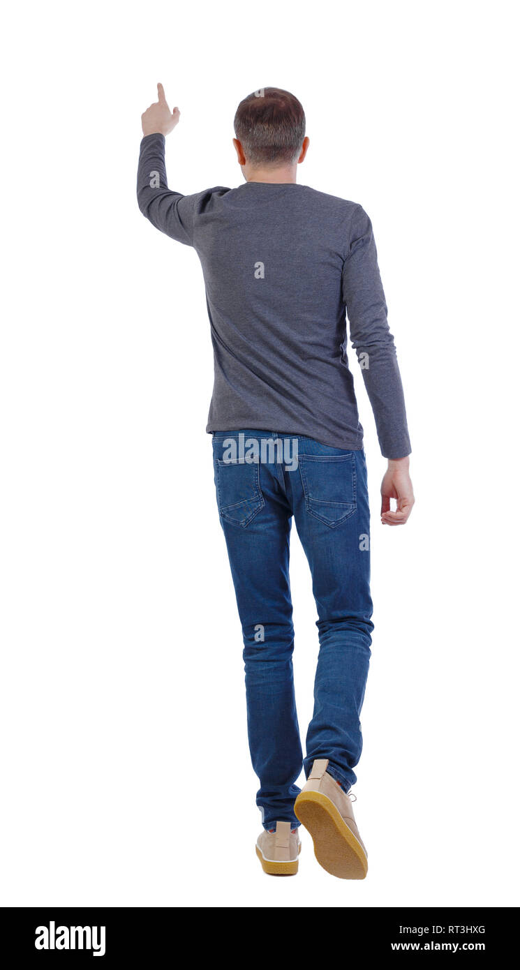 Back view of a man walking with a pointing hand. going guy showing ...
