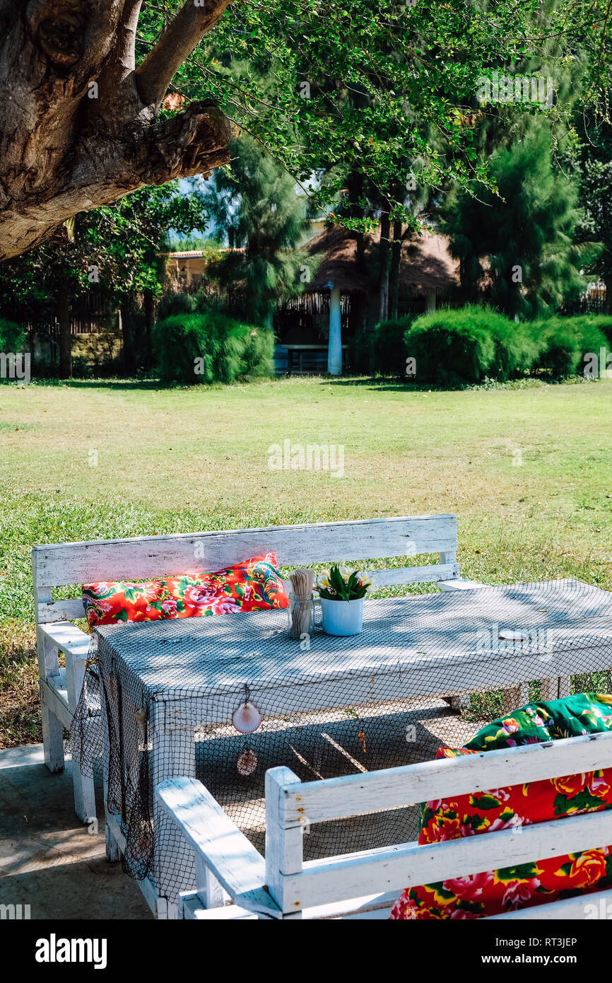 Image of Empty table in the house's garden Stock Photo - Alamy