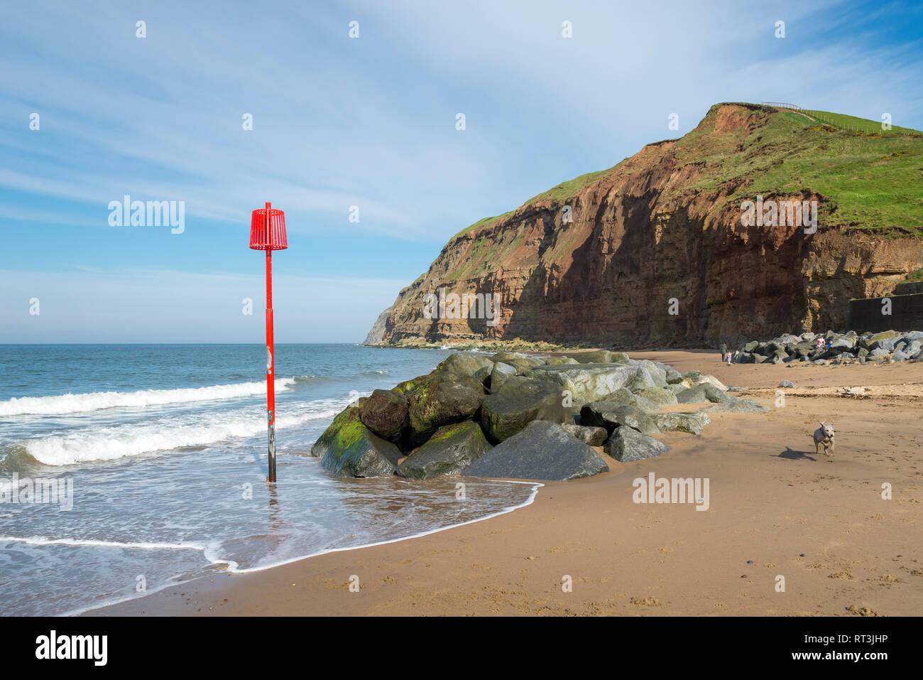Sandy beach and high cliffs at Skinningrove on the coast of North ...
