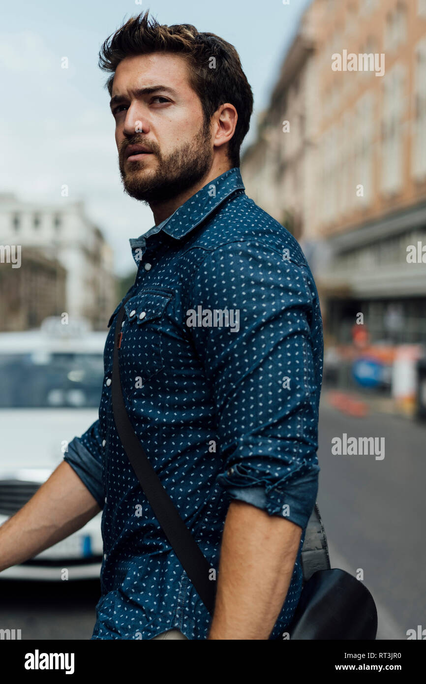 Italy, Rome, portrait of businessman crossing the street Stock Photo ...