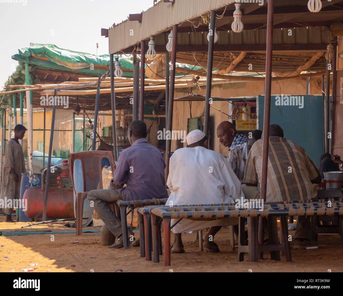 Khartoum, Sudan, February 6, 2019: Long-distance driver at lunch break ...