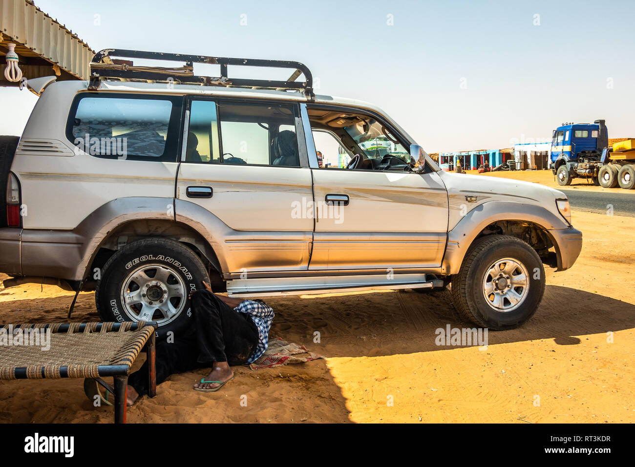 Khartoum, Sudan, February 6, 2019: Driver of an off-road vehicle tries ...