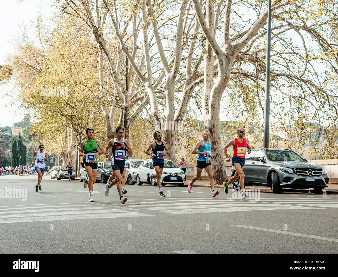 Rome, Italy - April 8, 2018: group of men running streets of Rome ...