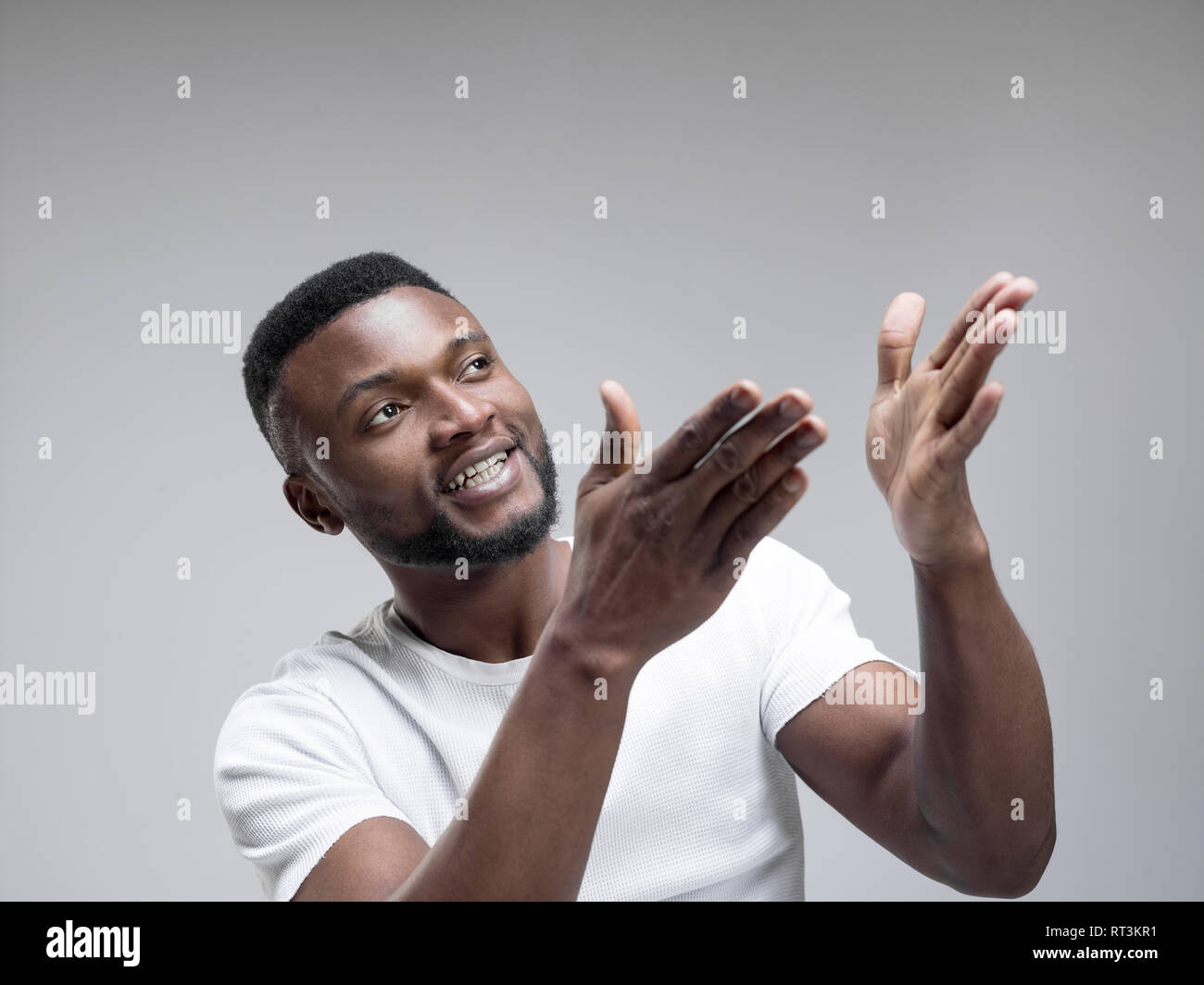 African american man excited about watching tv. Human emotions concept ...