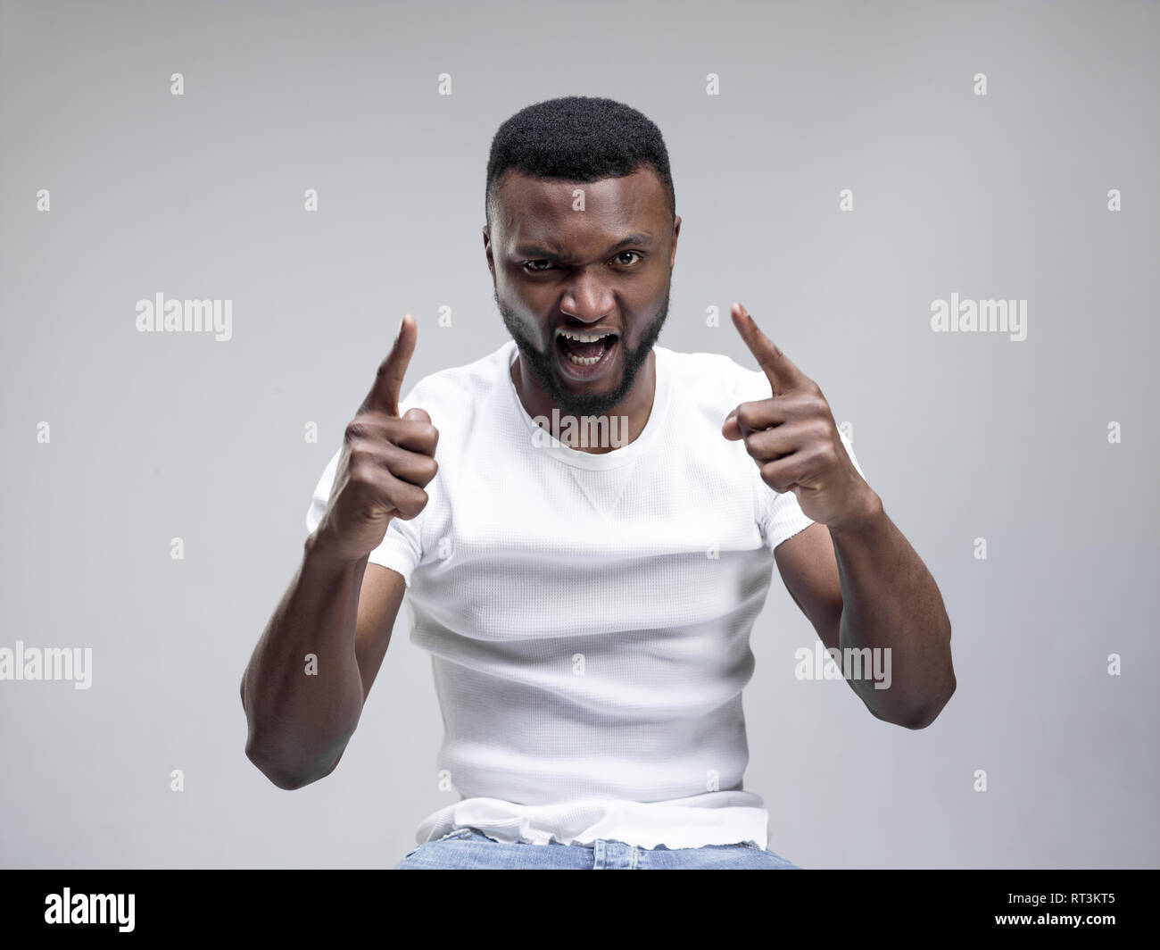 Screaming, hate, rage. Crying emotional angry african man screaming on ...