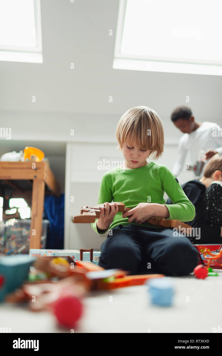 Boy playing blocks wood hi-res stock photography and images - Alamy
