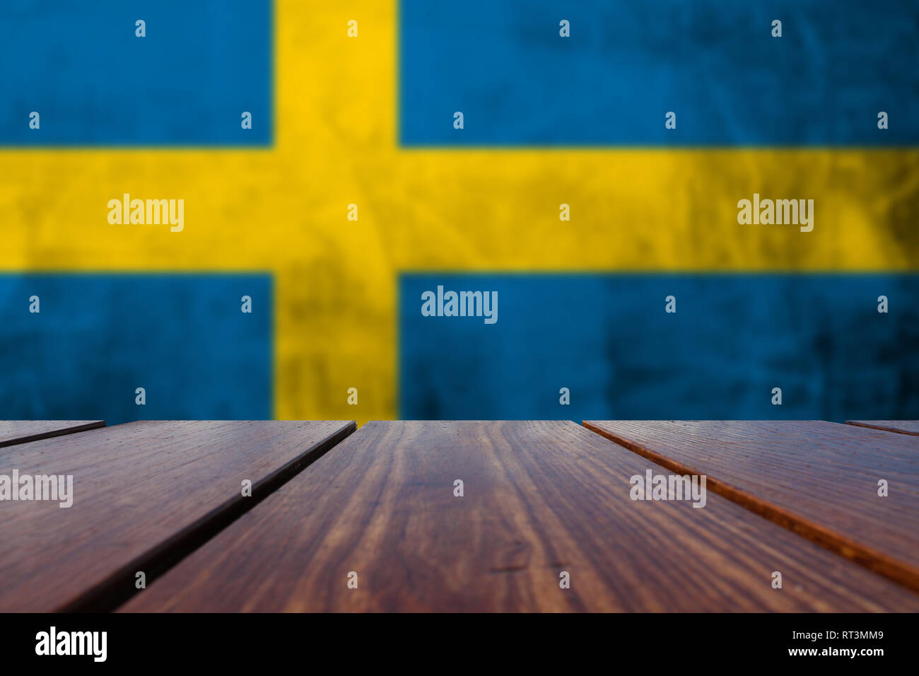 Wood Table Top Background and Grunge flag of Sweden on the concrete ...