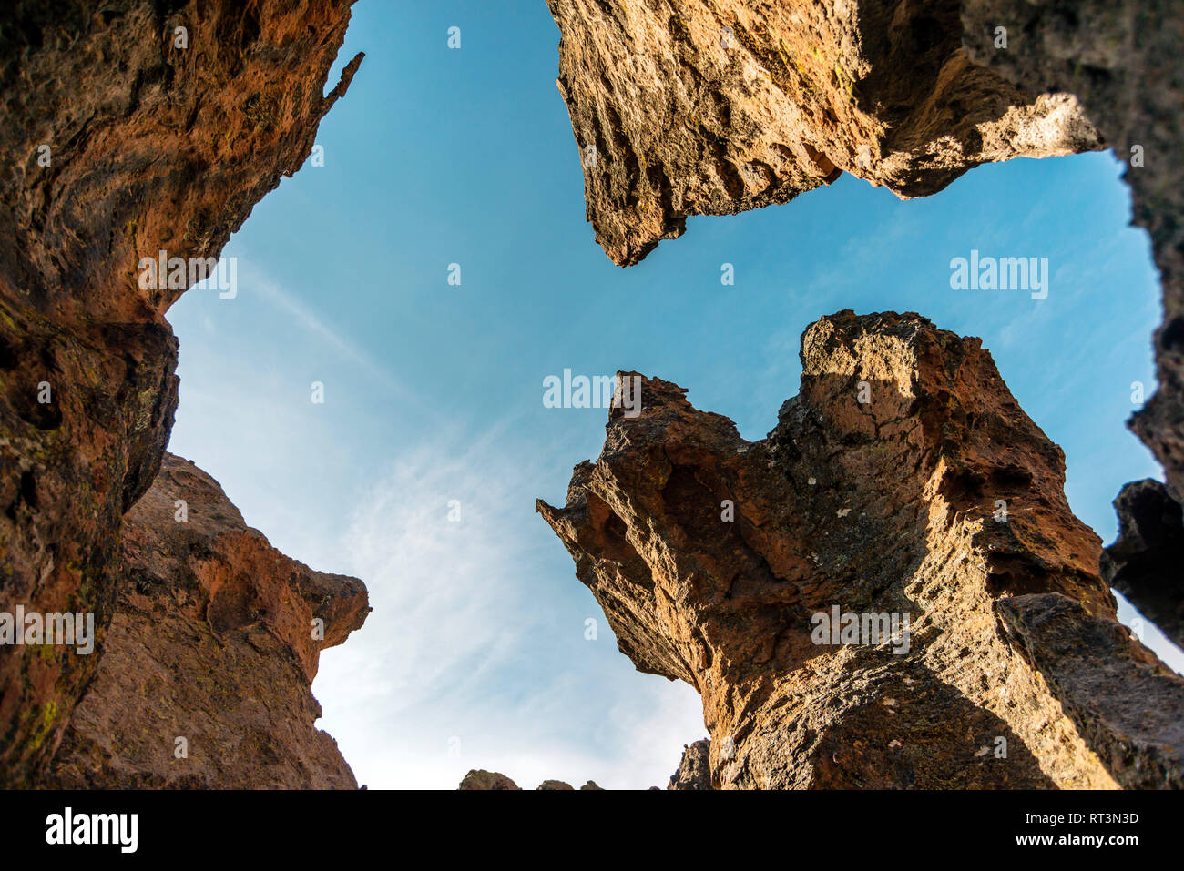 scenic view up to blue sky in surrounding stone rocks at place of ...