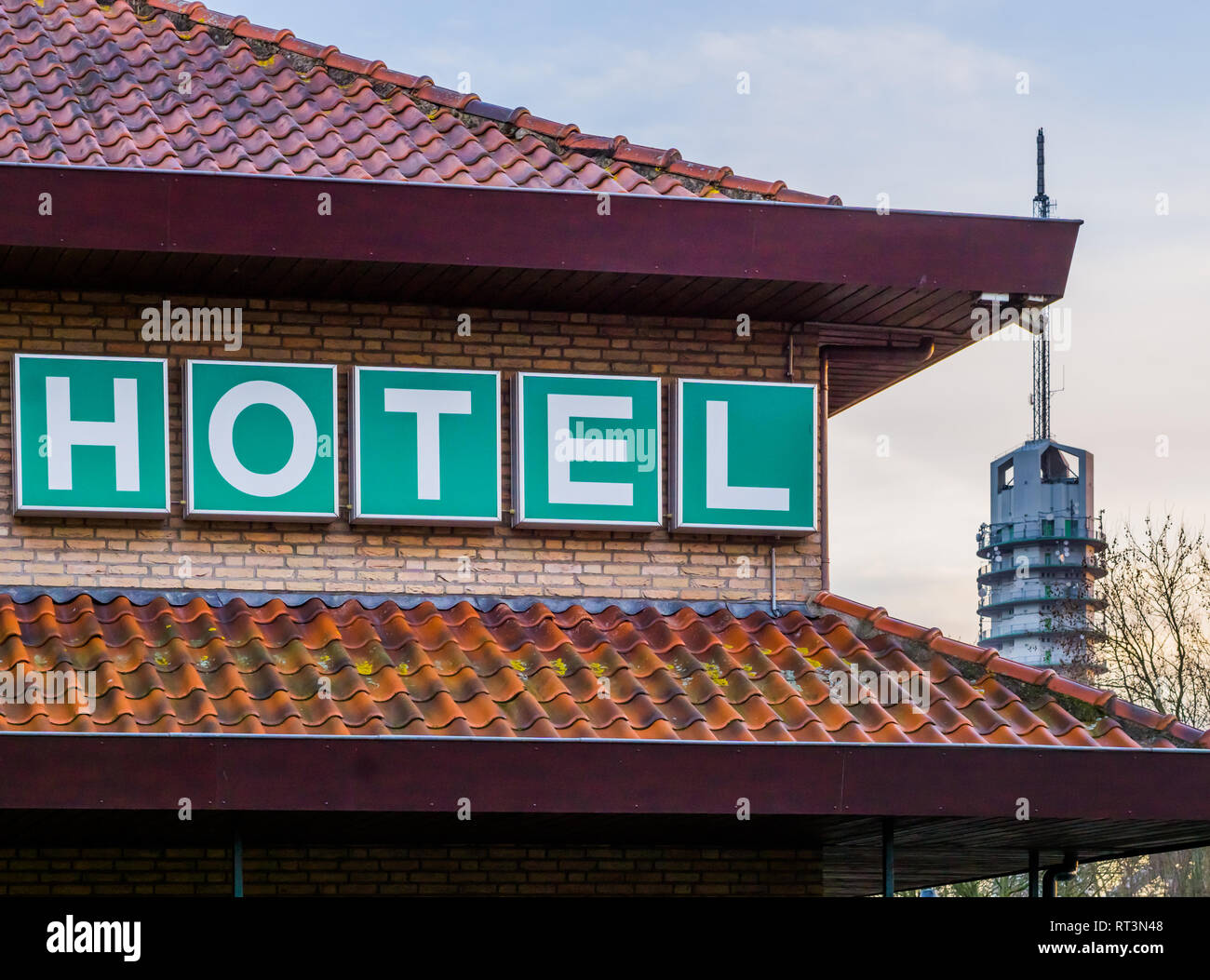 Hotel sign on the rooftop of a hotel, city scenery and architecture ...