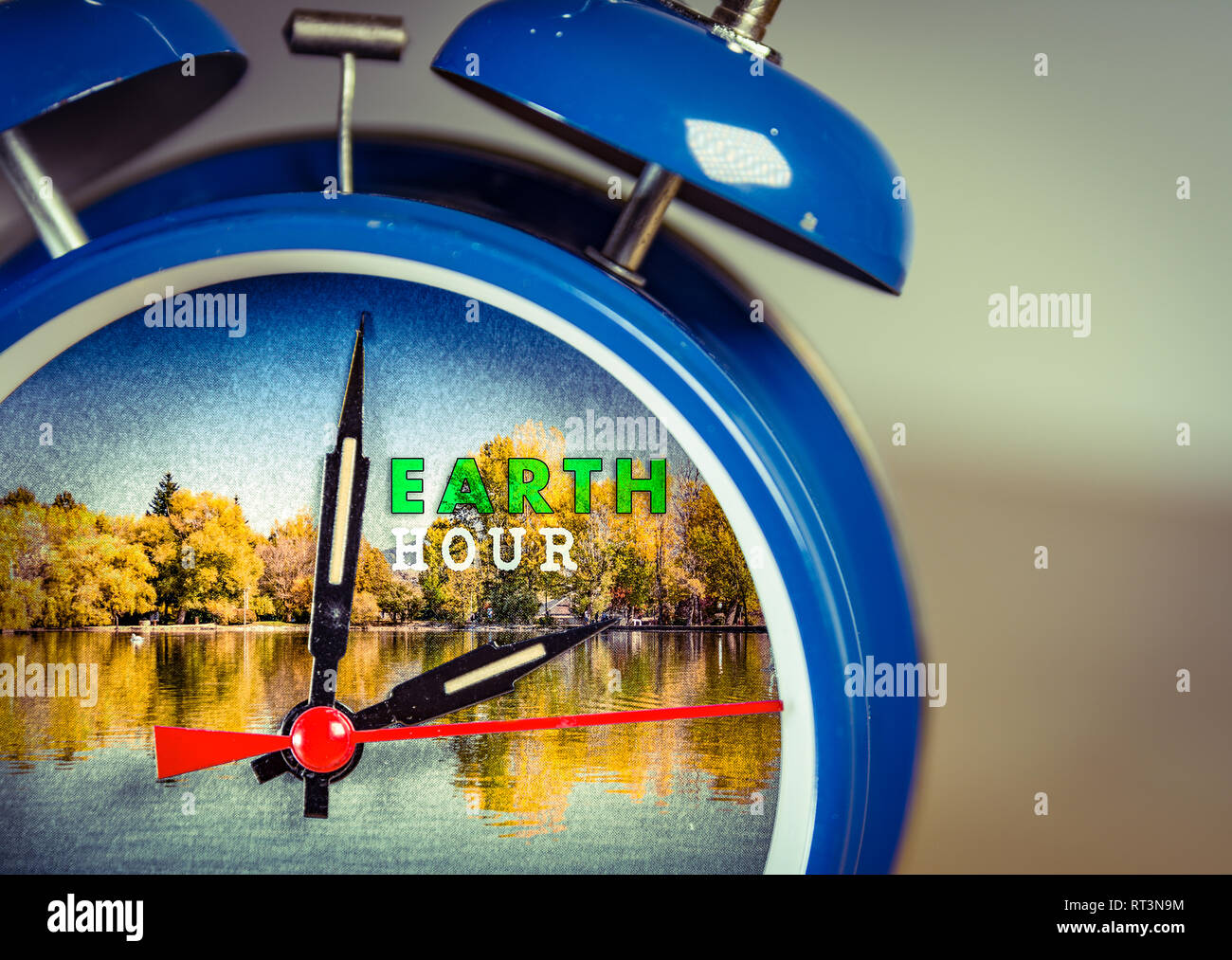 Retro alarm clock with nature background symbolizing Earth hour Stock ...