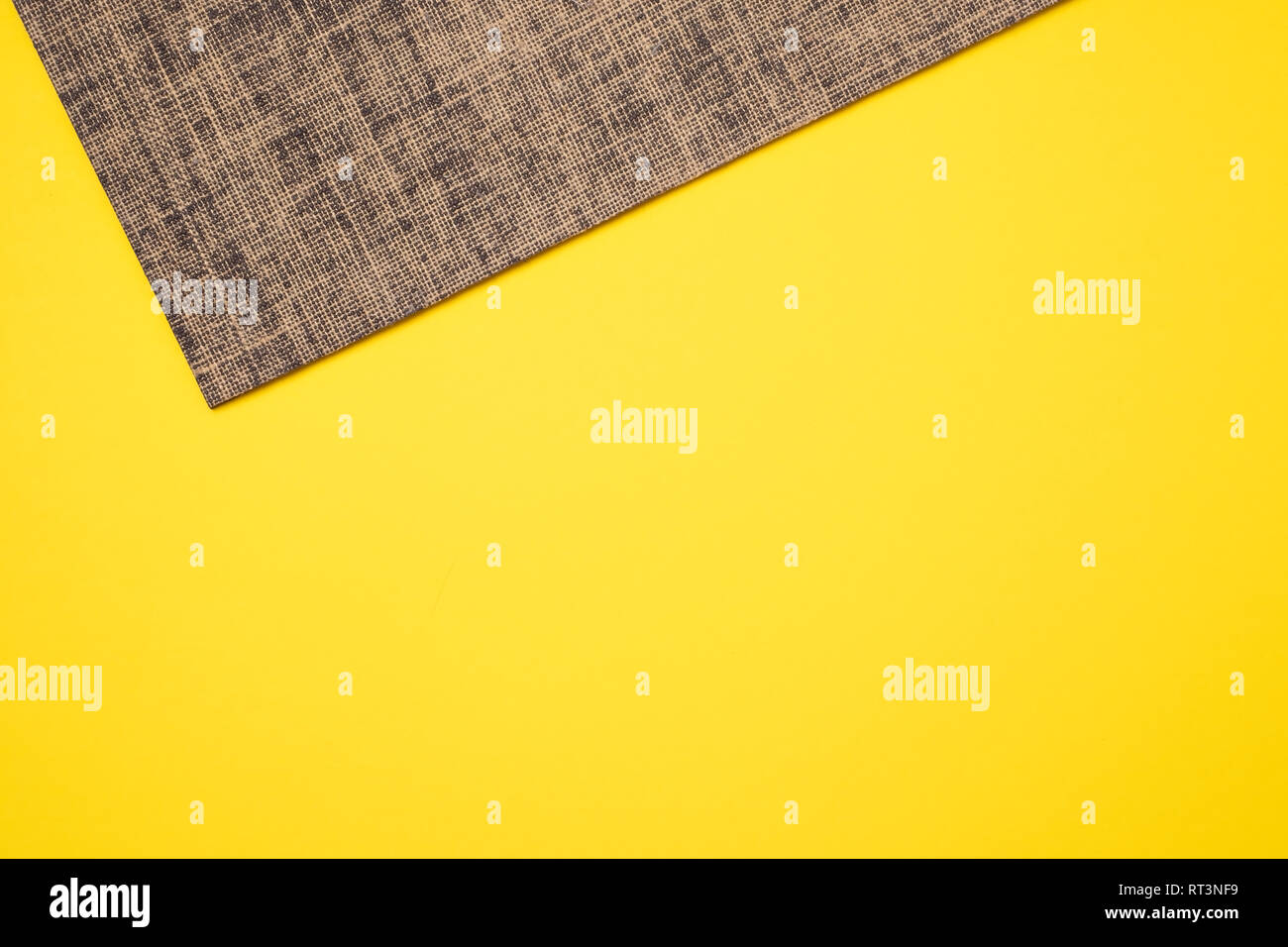 New yoga mat on a colored yellow background. Top View with copy space ...