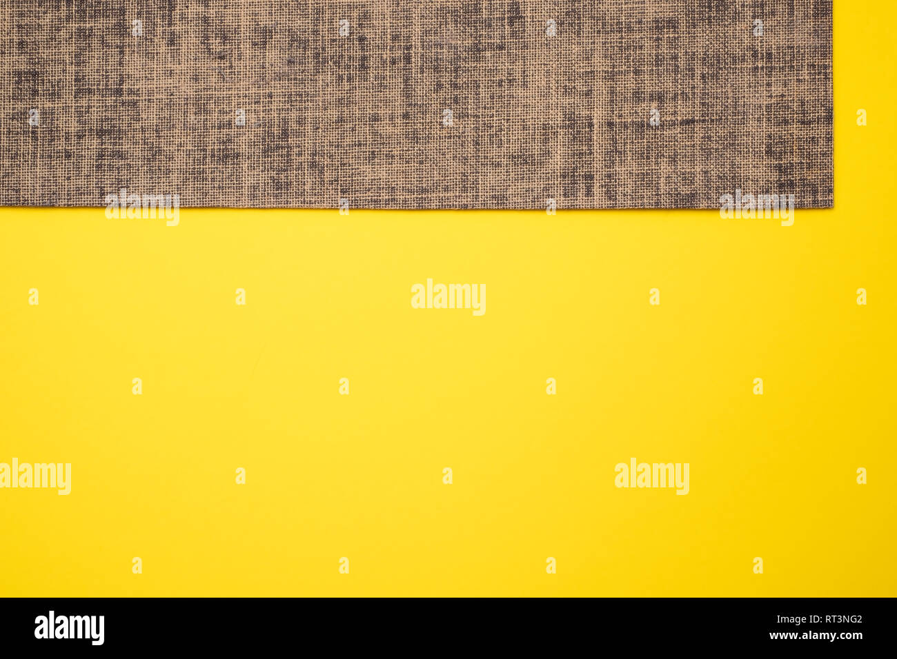 New yoga mat on a colored yellow background. Top View with copy space ...