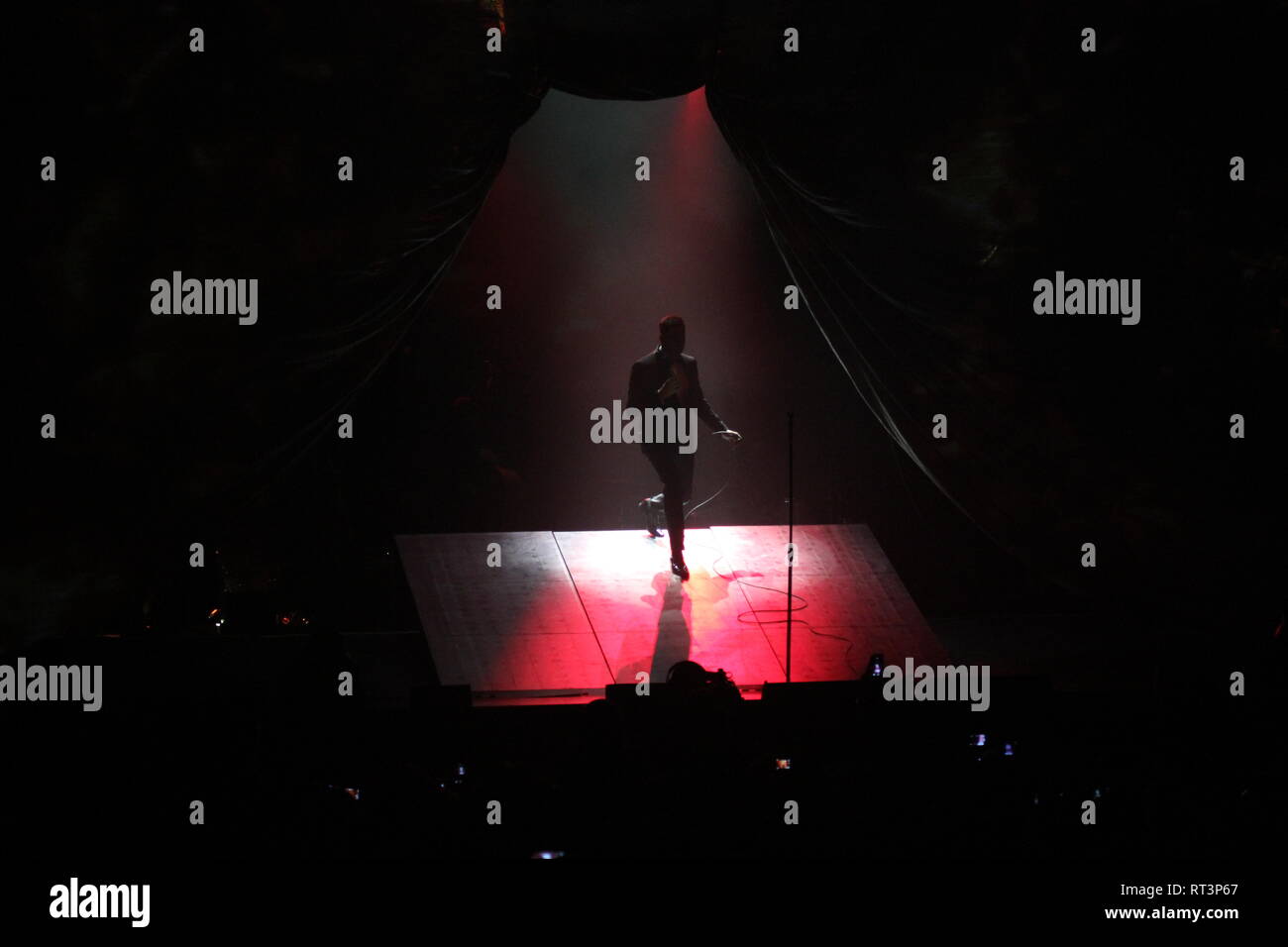 Singer Michael BublŽ is shown performing on stage during a "live ...