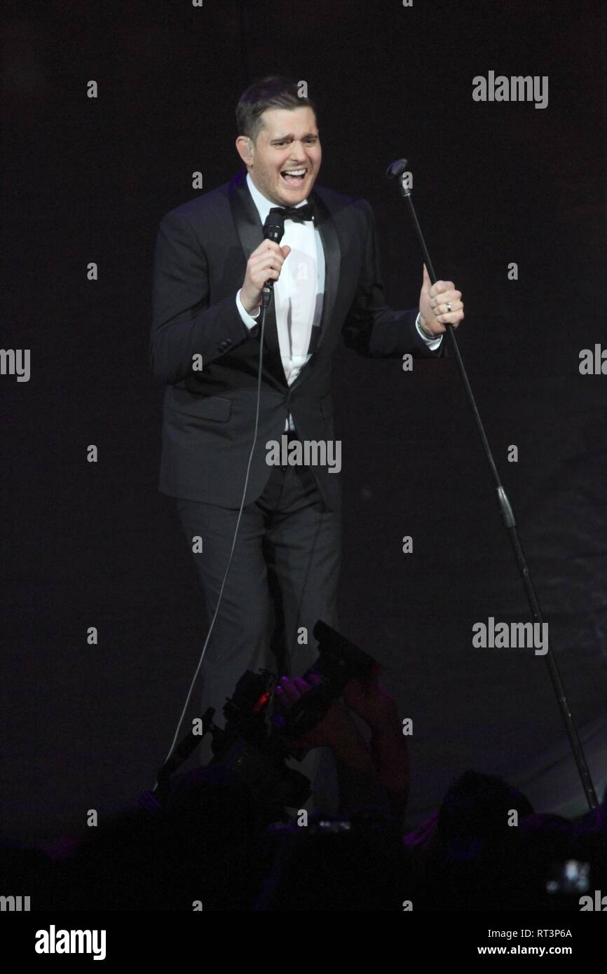 Singer Michael Bublé is shown performing on stage during a "live ...