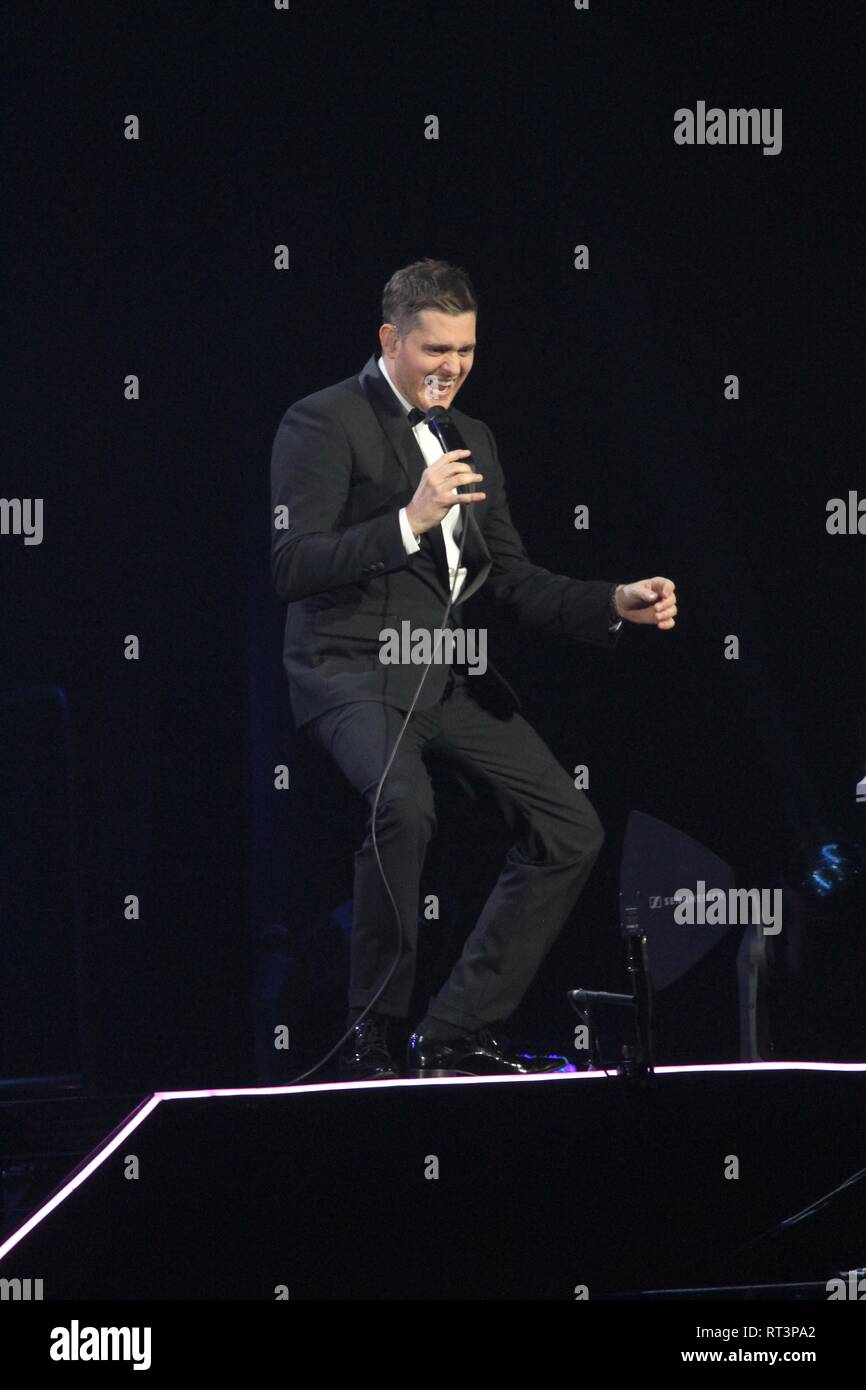 Singer Michael Bublé is shown performing on stage during a "live ...