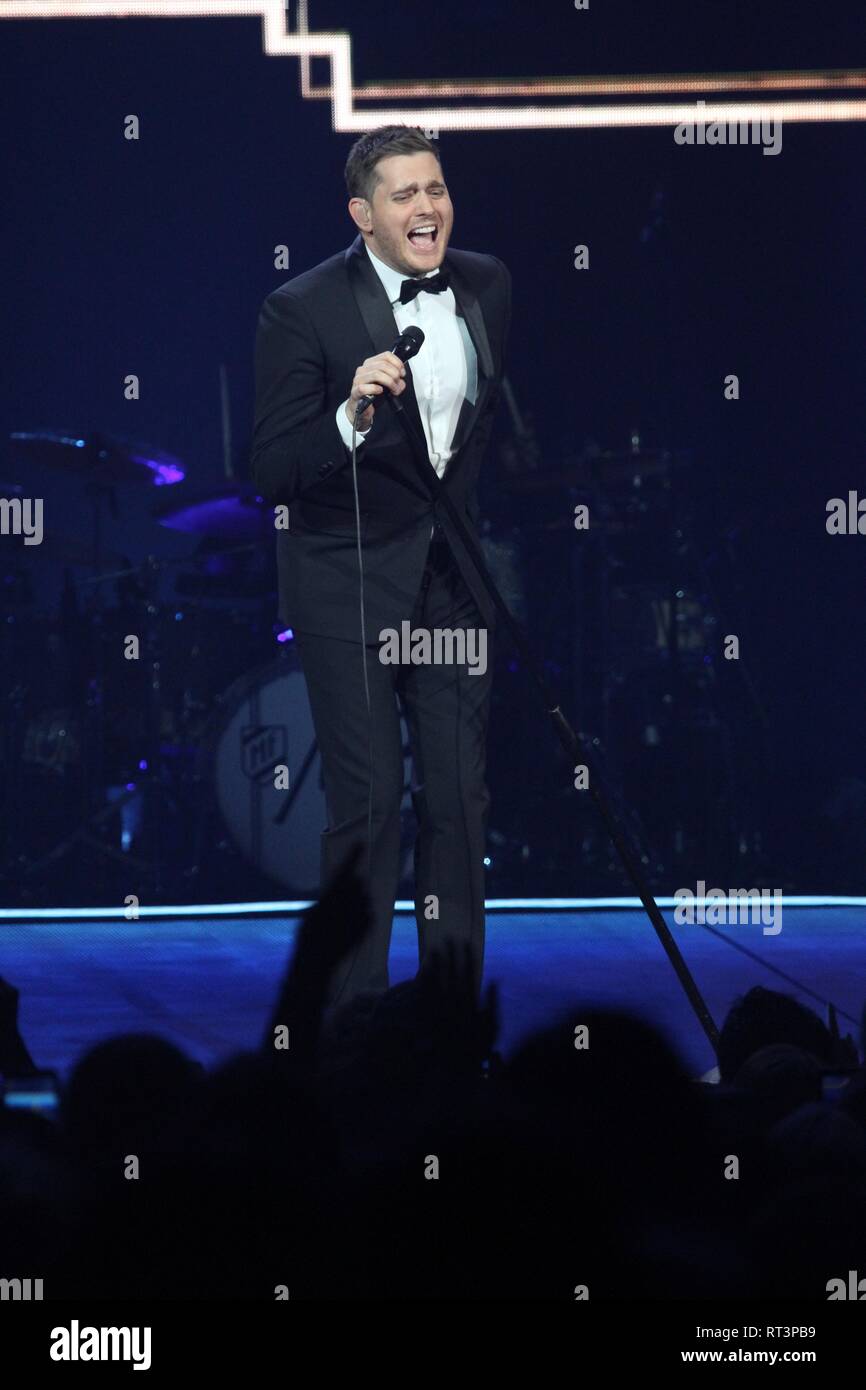 Singer Michael Bublé is shown performing on stage during a "live ...