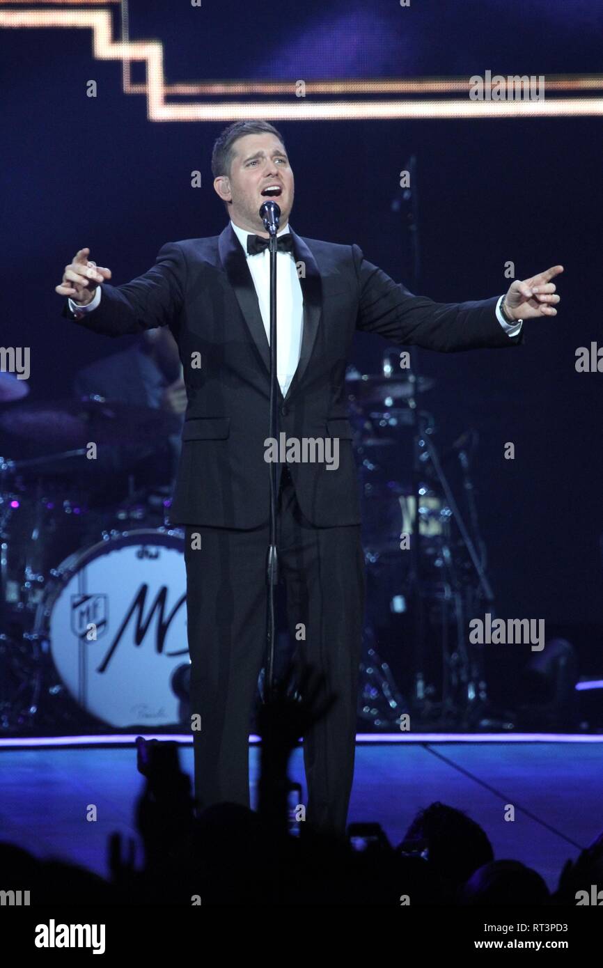 Singer Michael Bublé is shown performing on stage during a "live ...