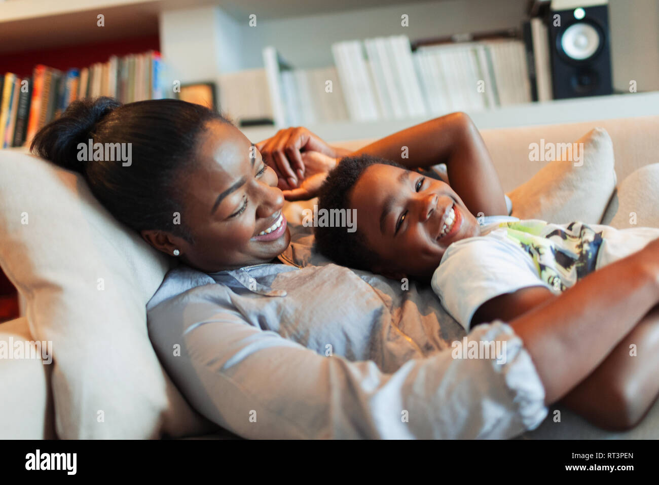 Portrait Happy Affectionate Mother And Son Cuddling On Living Room