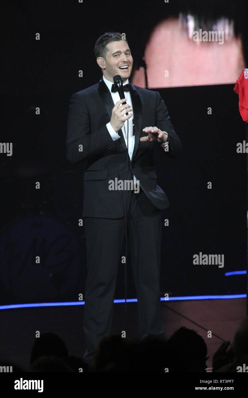 Singer Michael Bublé is shown performing on stage during a "live ...