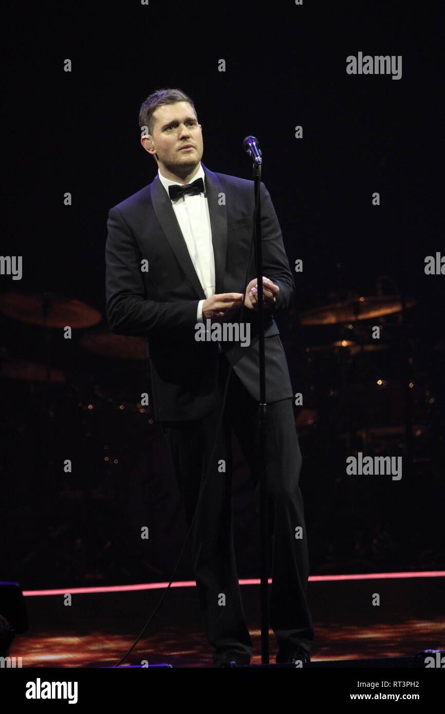 Singer Michael Bublé is shown performing on stage during a "live ...