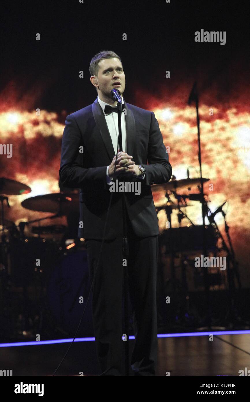 Singer Michael Bublé is shown performing on stage during a "live ...
