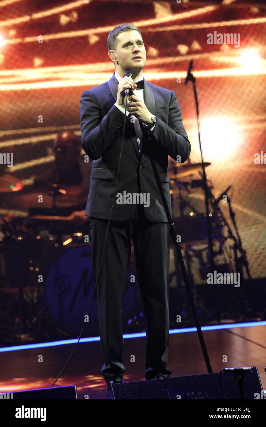 Singer Michael Bublé is shown performing on stage during a "live ...