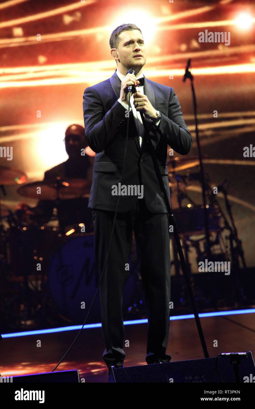 Singer Michael Bublé is shown performing on stage during a "live ...