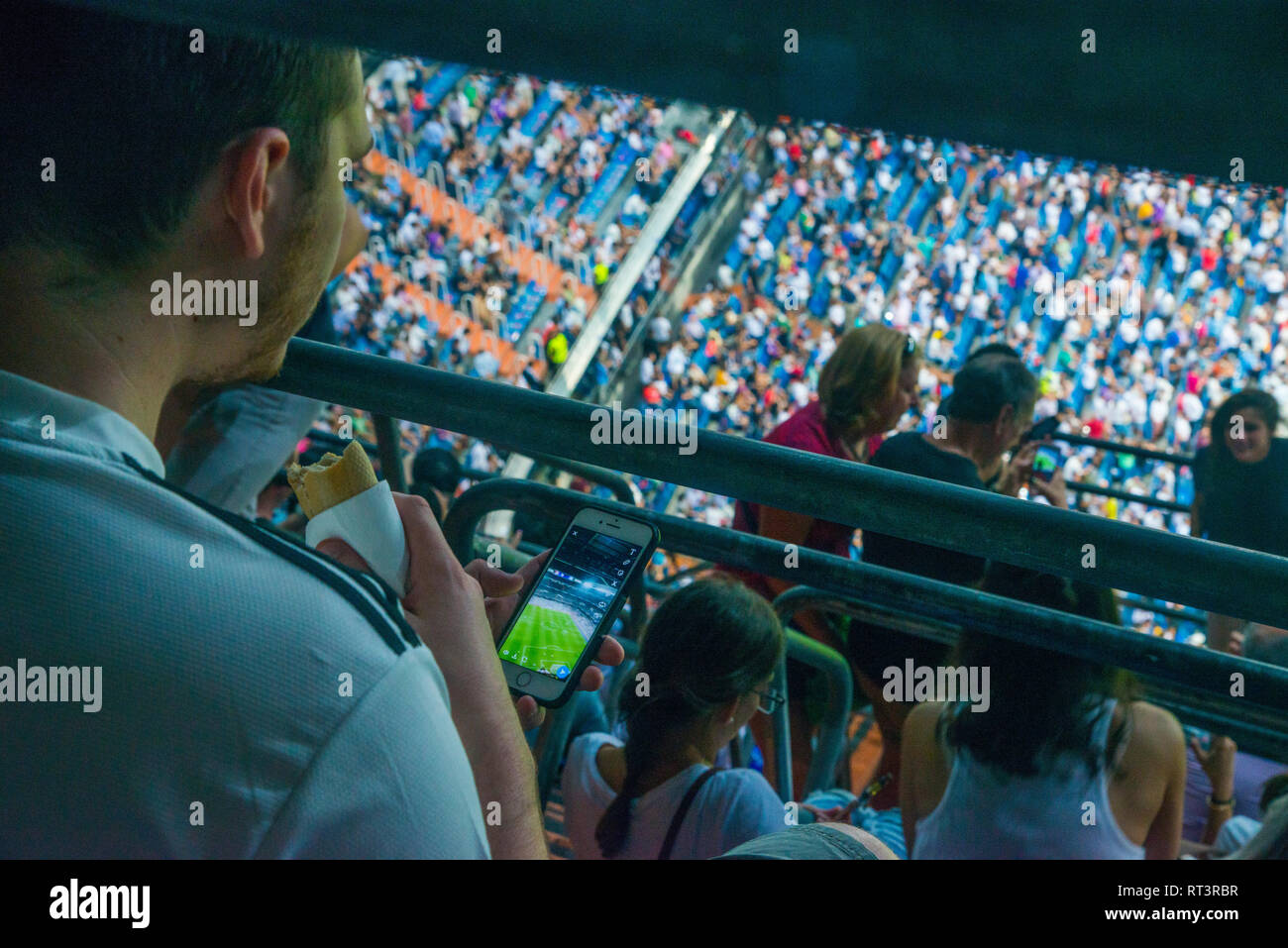Spectators during a football match. Santiago Bernabeu stadium, Madrid ...