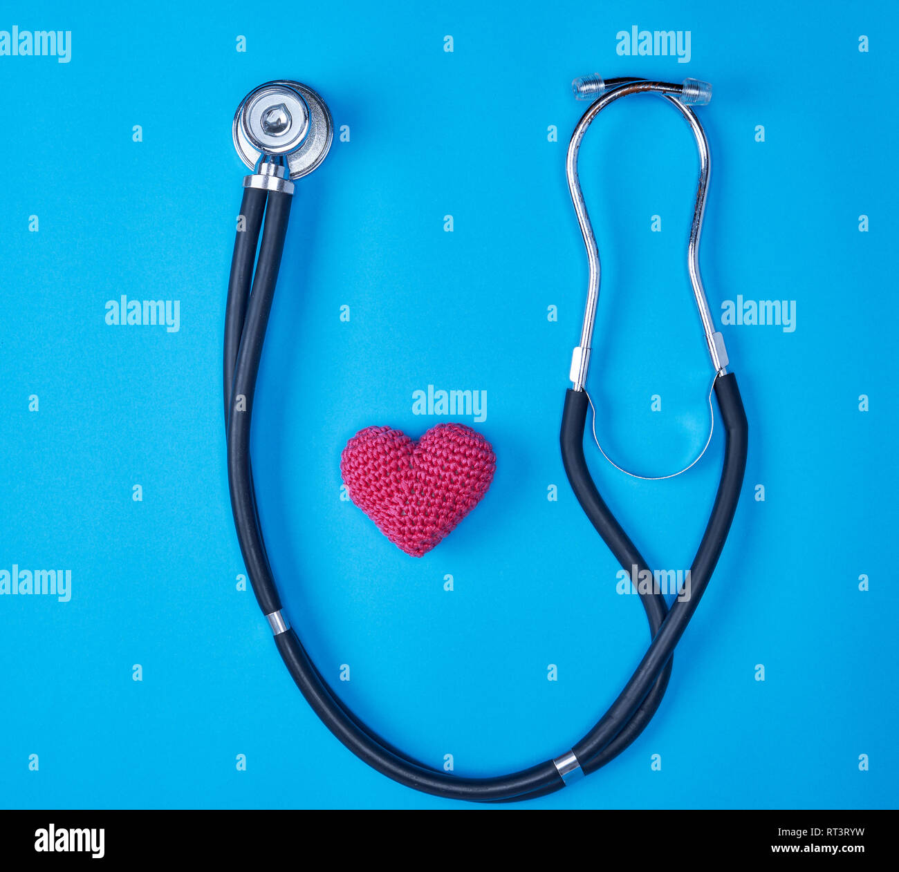 medical black phonendoscope on a blue background Stock Photo - Alamy