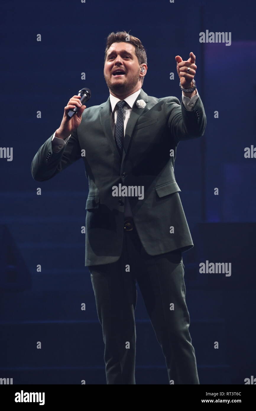 Singer Michael BublŽ is shown performing on stage during a "live ...