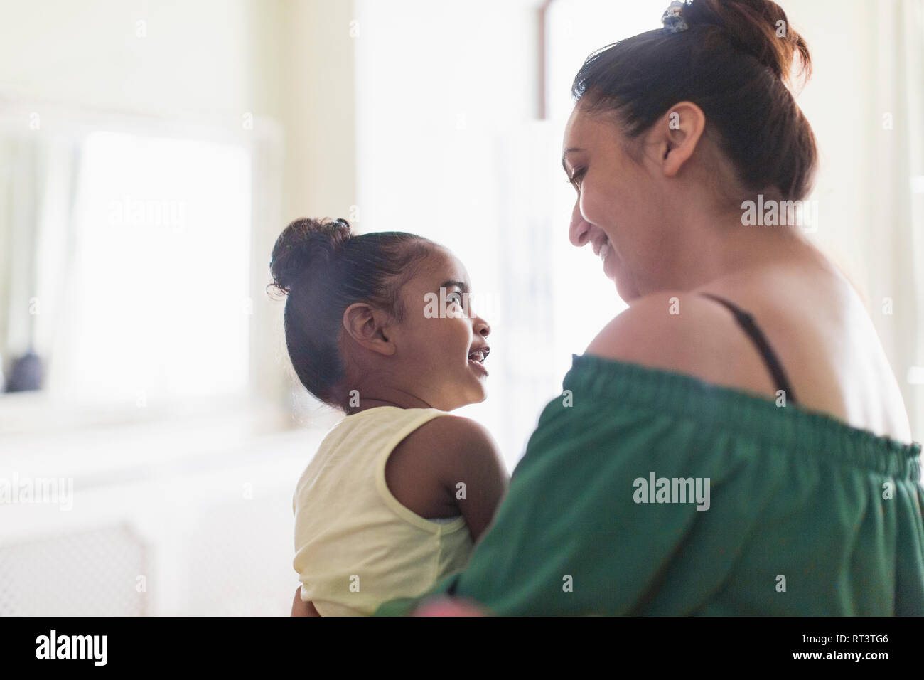 Mother and toddler daughter talking Stock Photo - Alamy