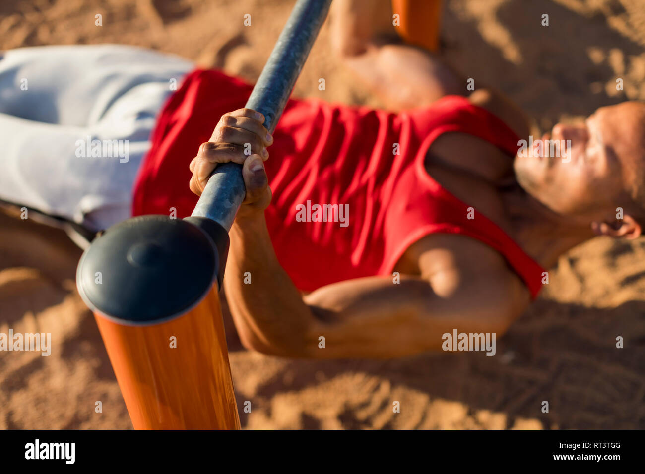 Fit man working out in climbing parcour, doing pull ups Stock Photo - Alamy
