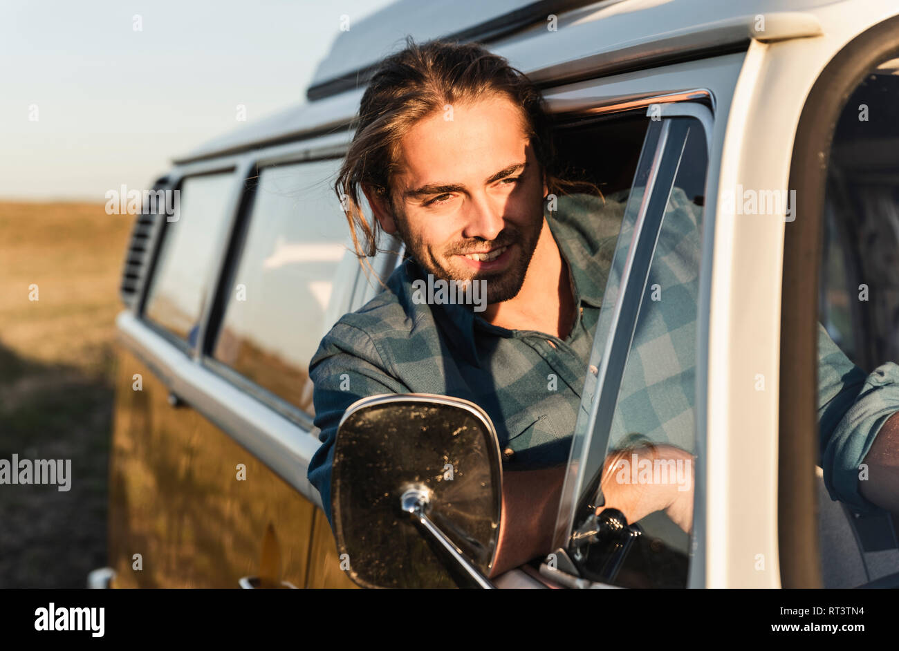 Young man on a road trip with his camper Stock Photo - Alamy