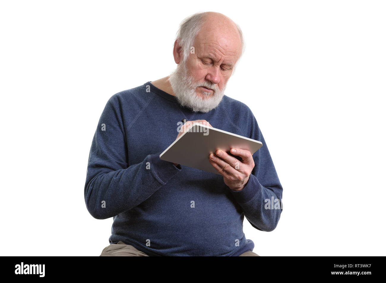 Funny old man using tablet computer isolated on white Stock Photo - Alamy