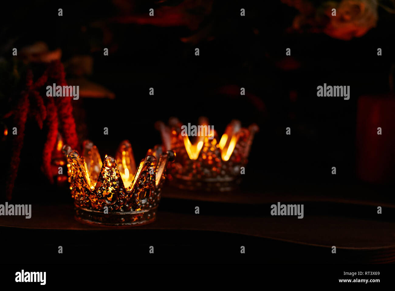 Beautiful burning candles in the candlestick in the form of a crown ...