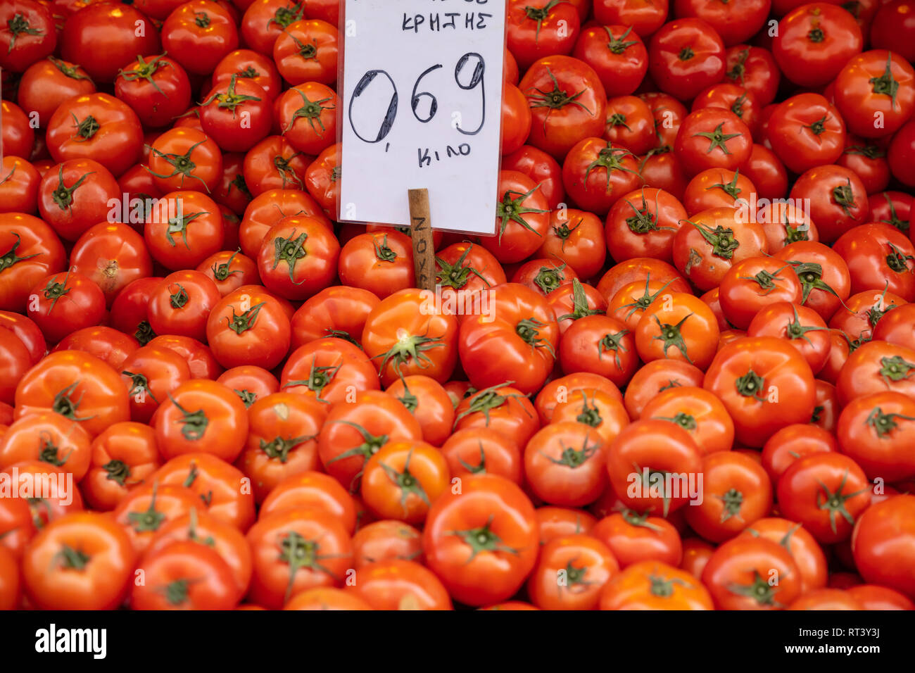 Tomatoes pile with price tag on a street market stall, Athens Greece ...