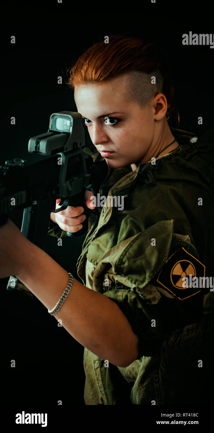 Young woman with red hair in military green uniform Stock Photo - Alamy