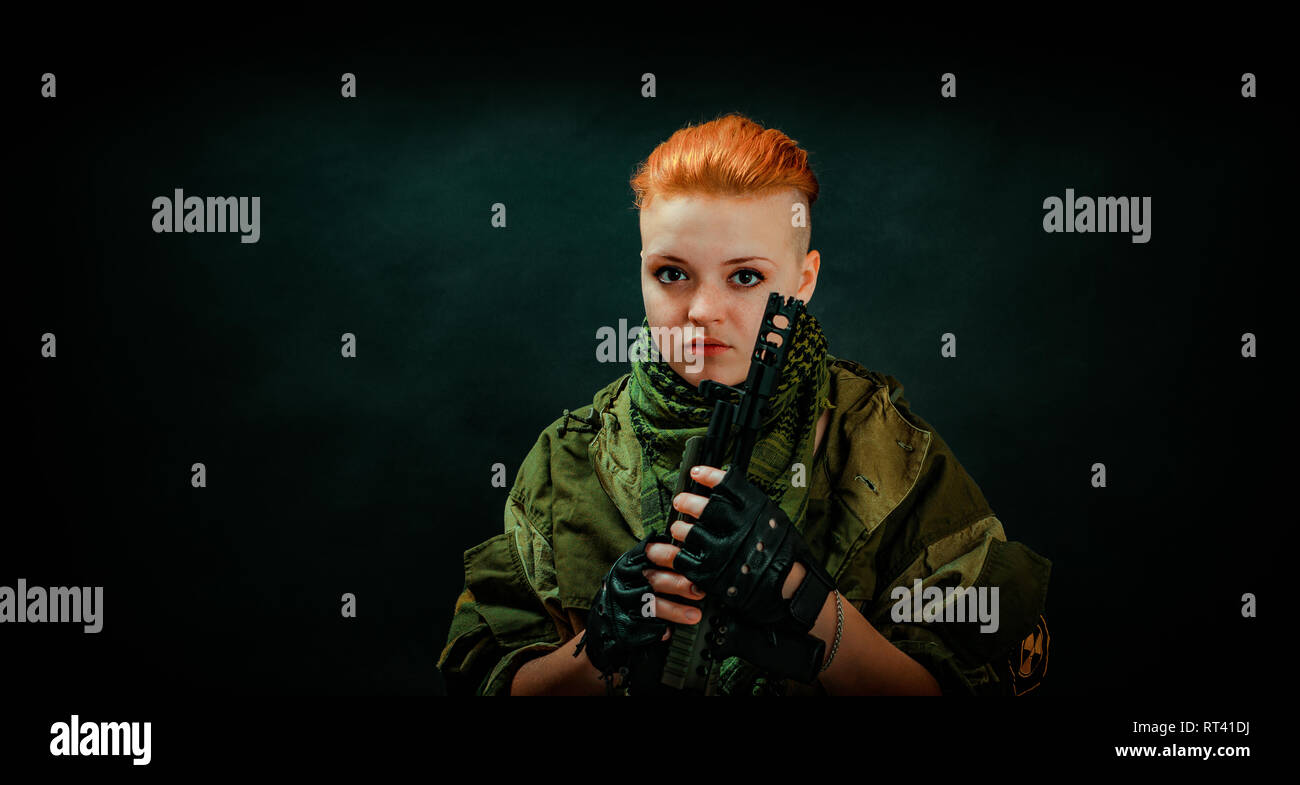 Young woman with red hair in military green uniform Stock Photo - Alamy