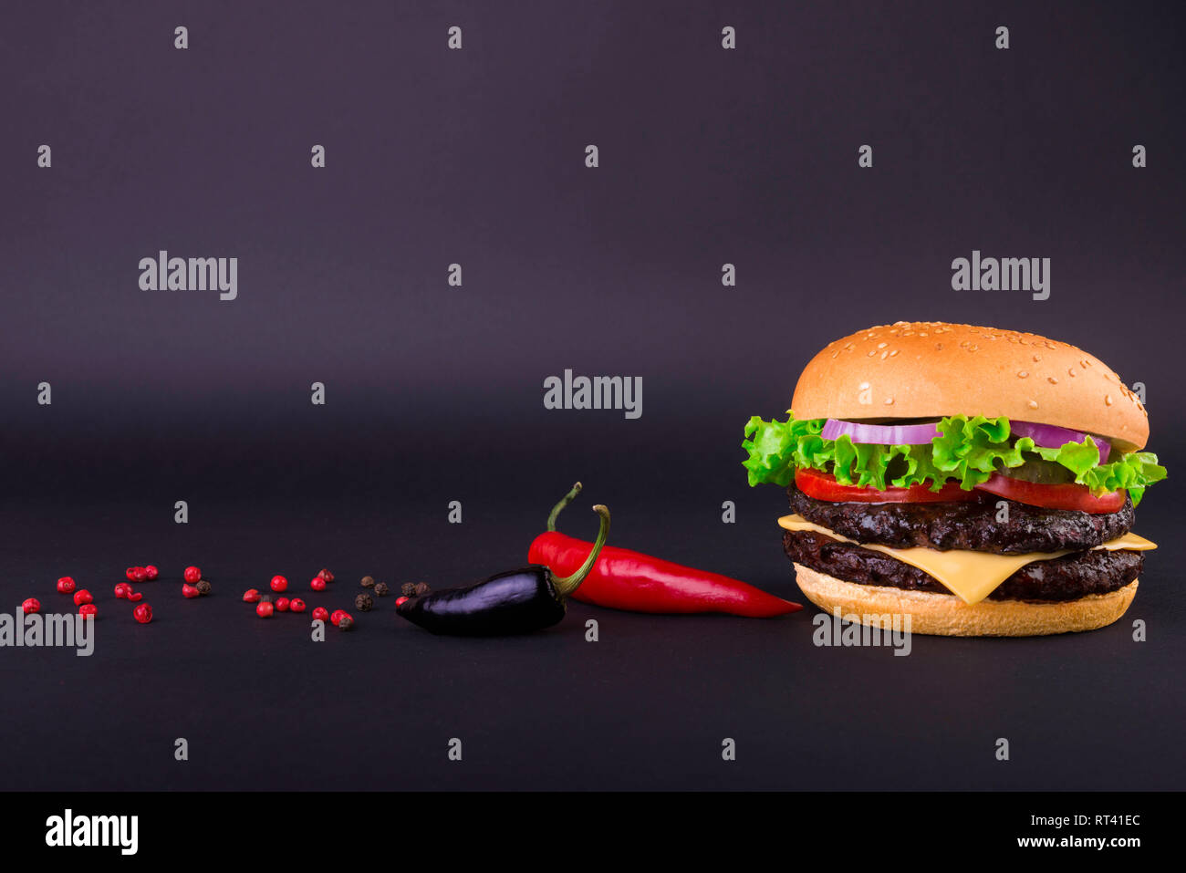 Burger on a black background Stock Photo - Alamy