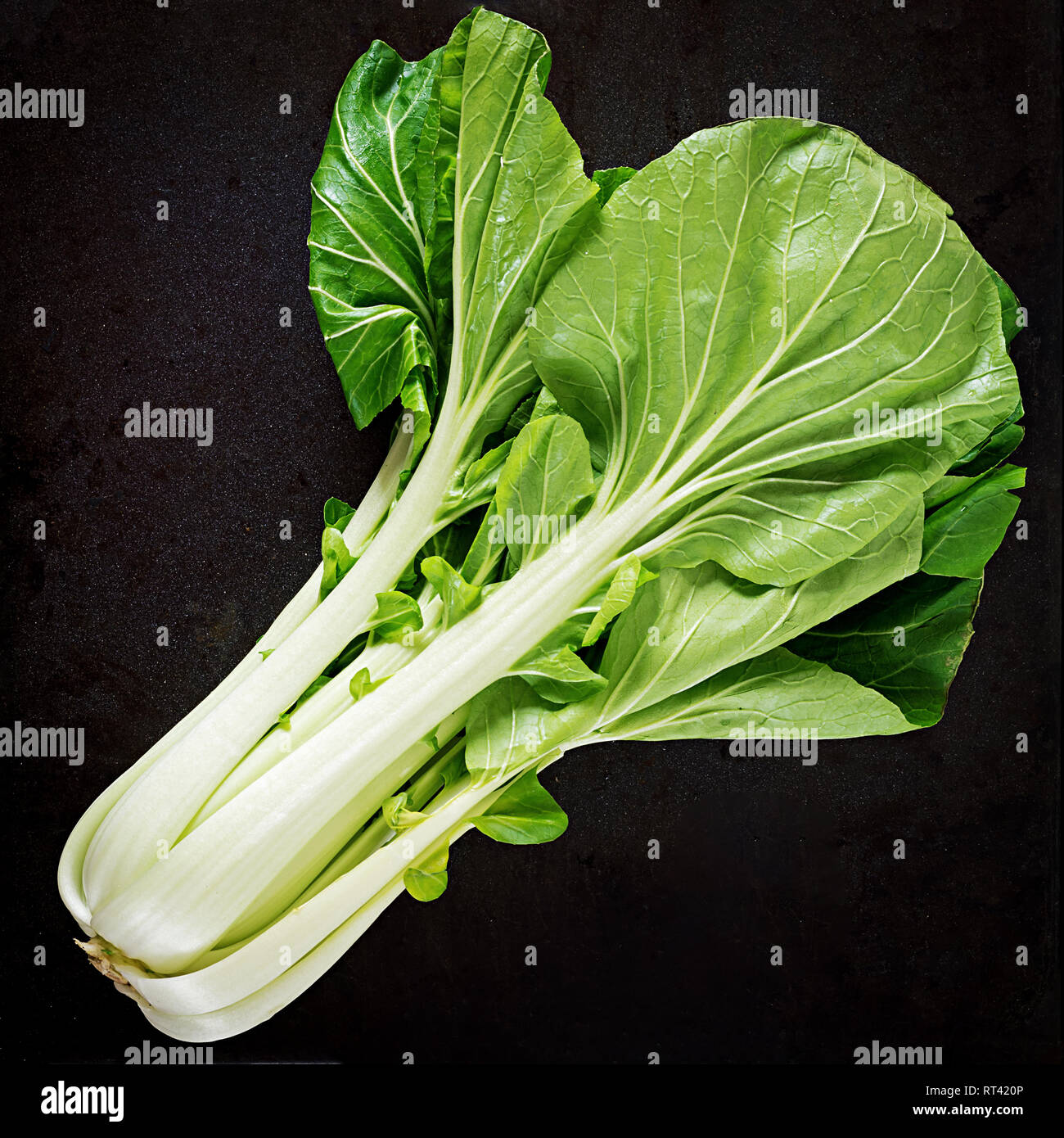 Bok choy or Chinese-cabbage on black table. Pak choi. Top view Stock ...