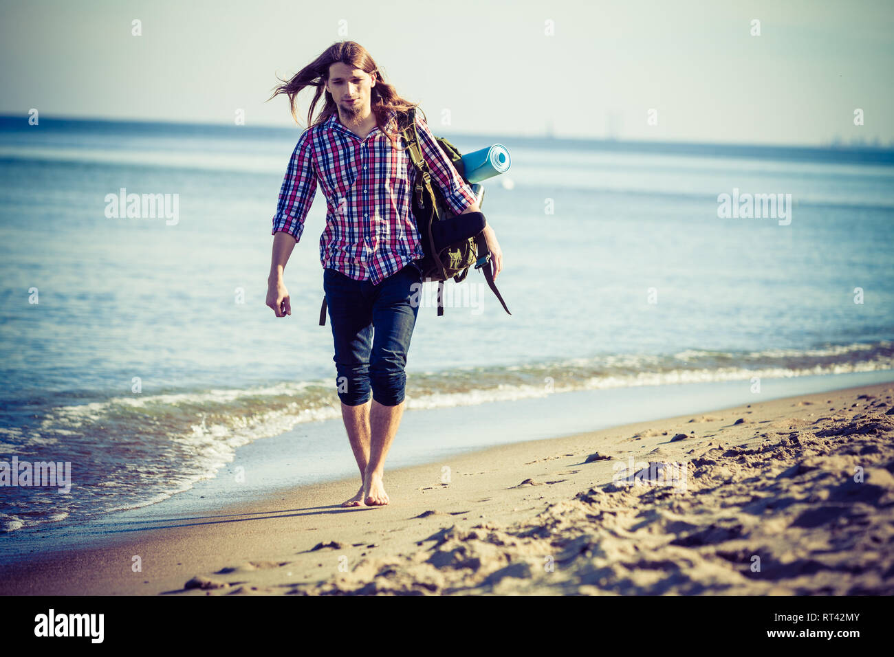 Barefoot Backpacker On The Beach High Resolution Stock Photography and ...